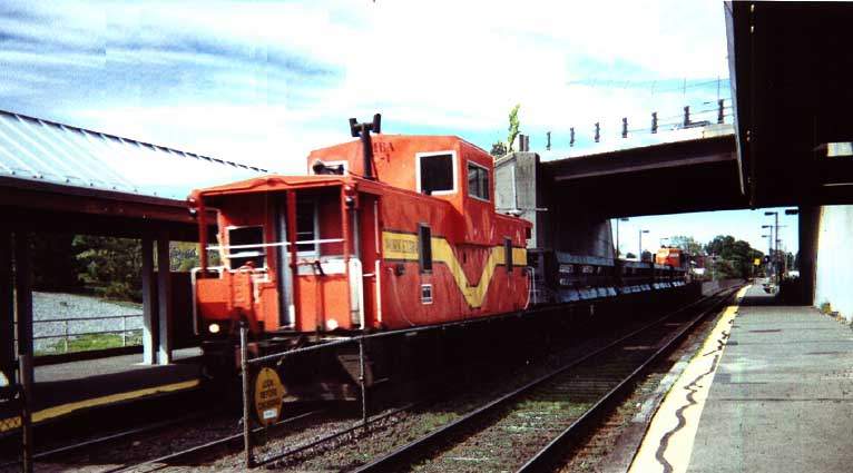 MBTA GP9 904 pushing the empty work train towards Boston is captured at ...