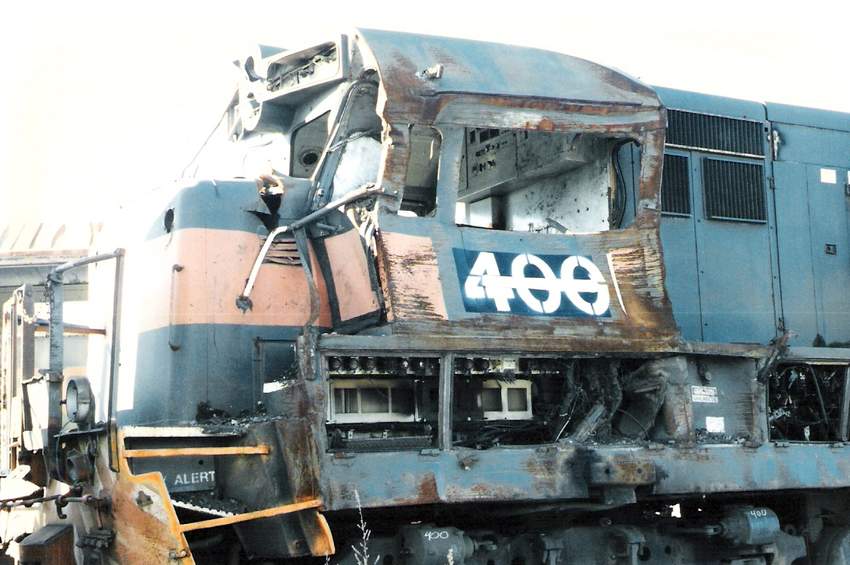 Closeup of wrecked MEC #400 (ex-#406) whitelined behind Waterville ...